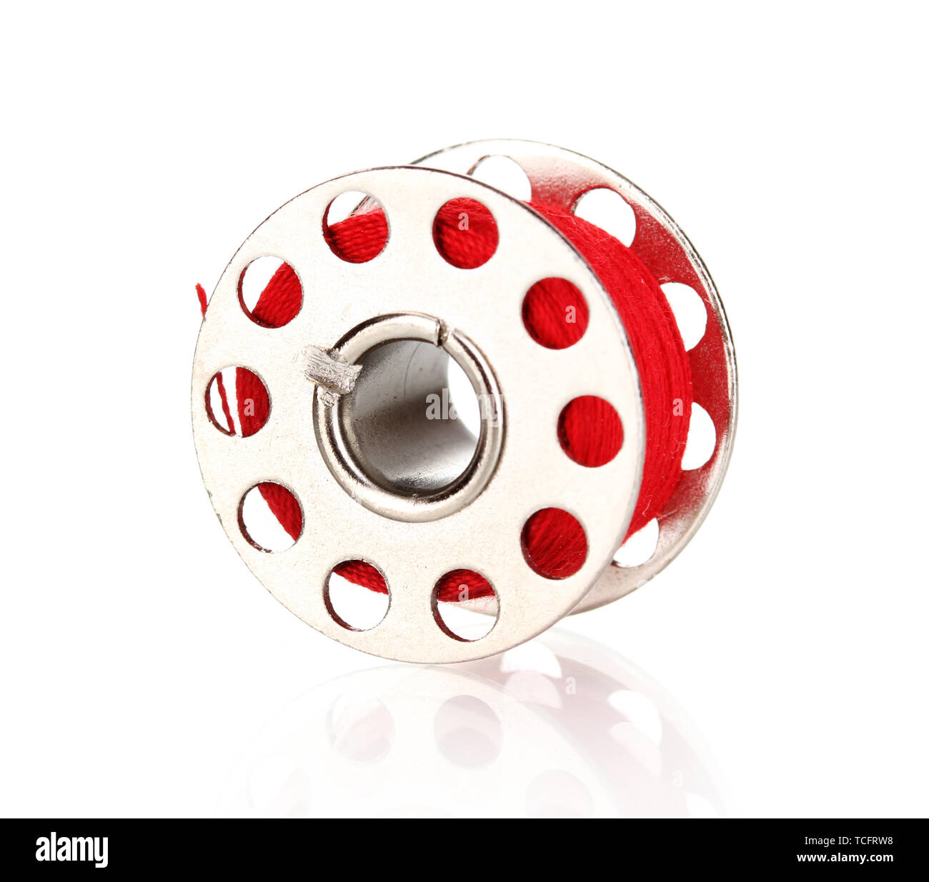 Metal spool of thread isolated on white Stock Photo - Alamy