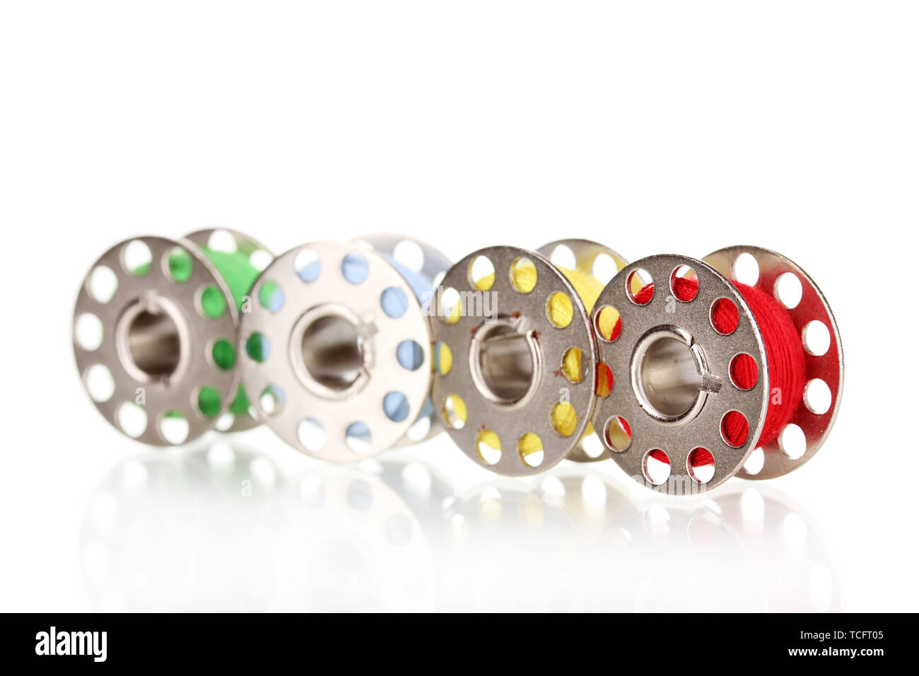 Metal spools of thread isolated on white Stock Photo - Alamy