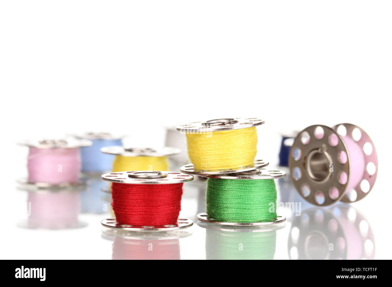 Metal spools of thread isolated on white Stock Photo - Alamy