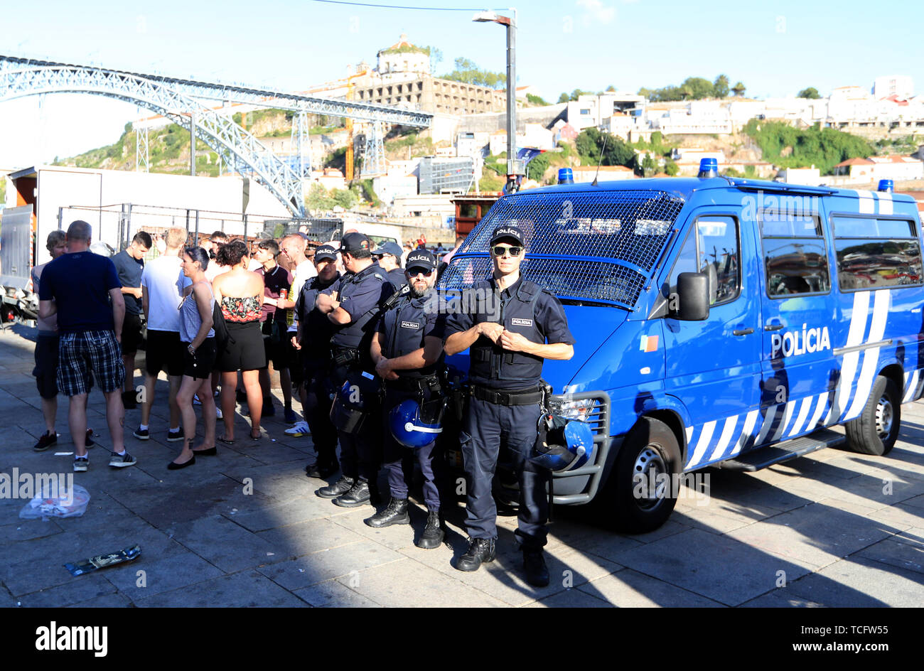 Police watch the England fans in Porto Stock Photo - Alamy