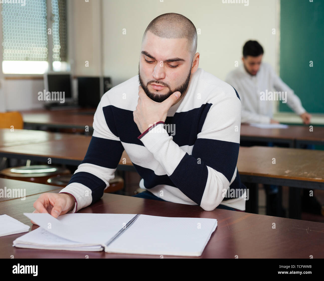 Portrait of young Arabic university student preparing for exams at ...