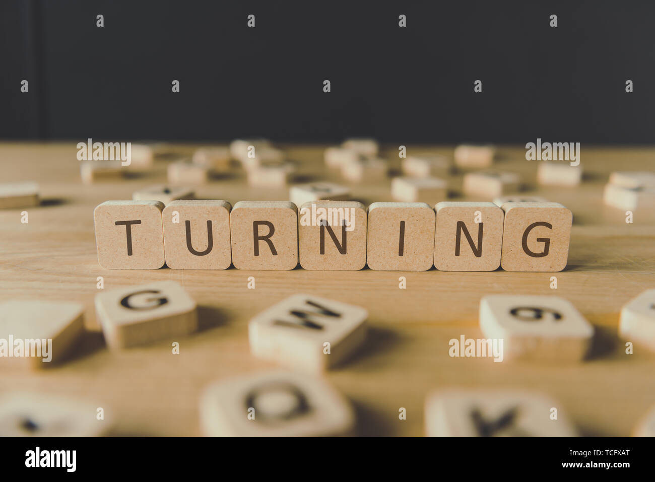 selective focus of word turning made of cubes surrounded by blocks with ...