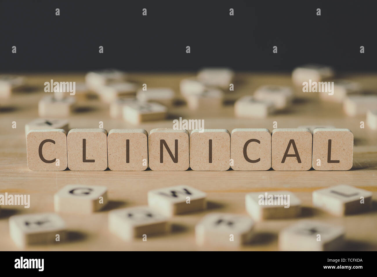 selective focus of clinical lettering on cubes surrounded by blocks ...