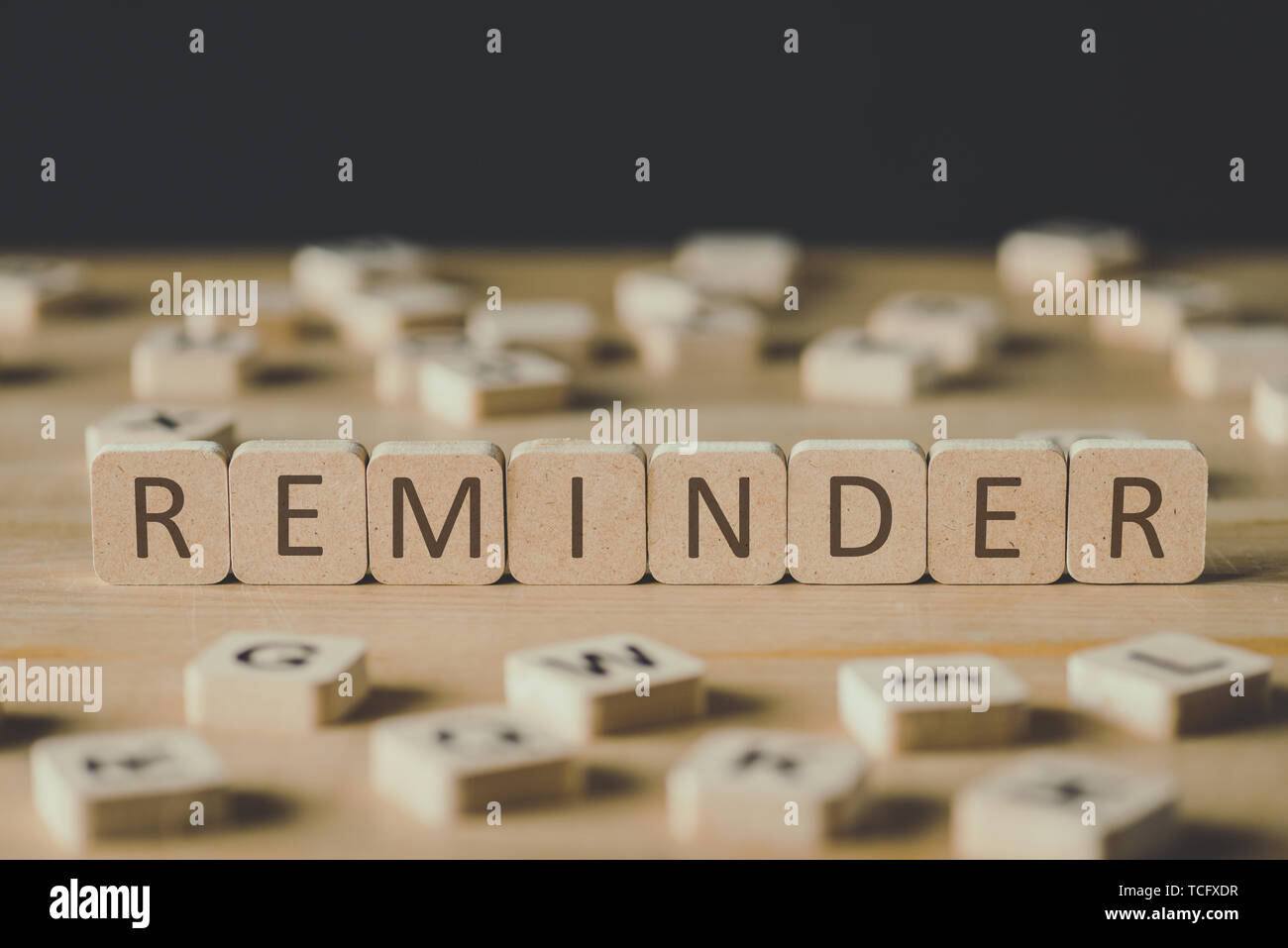 selective focus of word reminder made of cubes surrounded by blocks ...