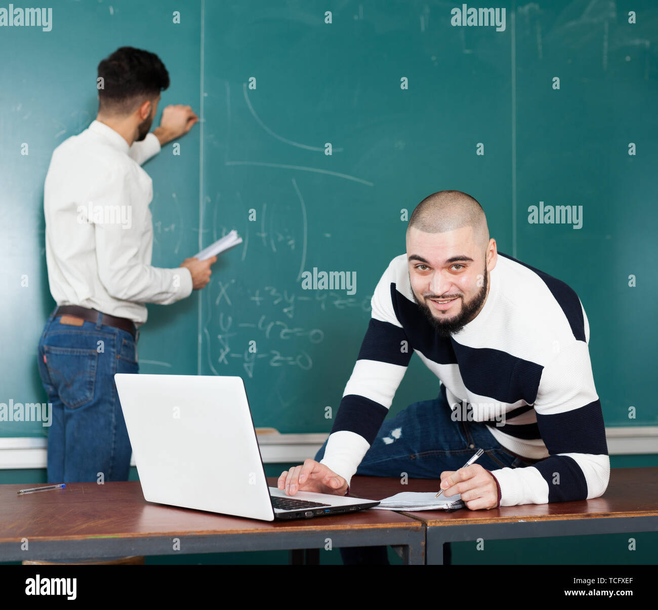 Two students working together classroom hi-res stock photography and ...