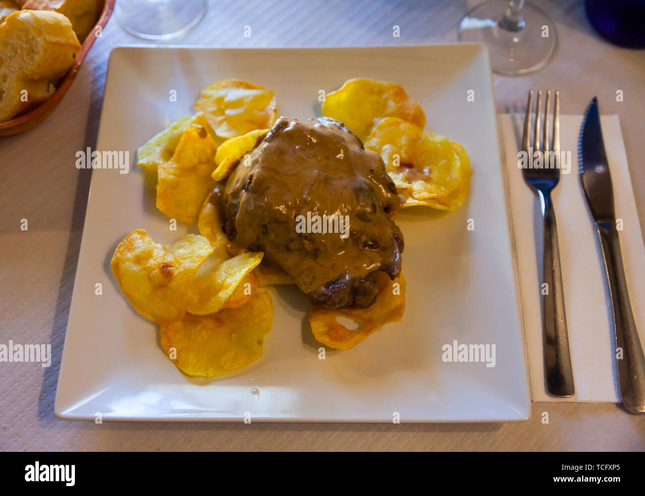 Dish of Spanish cuisine – pork cheeks in red wine Stock Photo - Alamy
