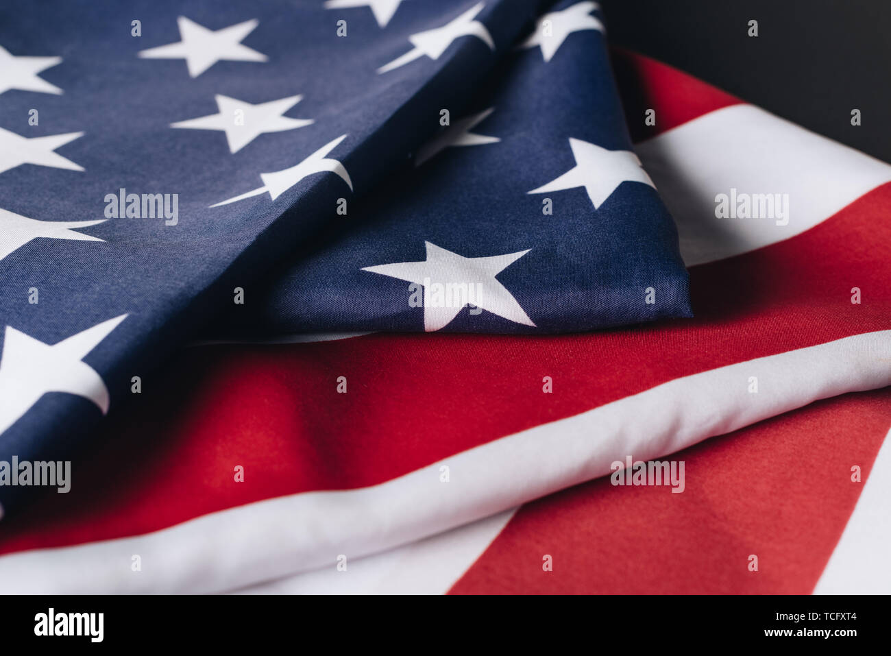 folded usa national flag isolated on black, memorial day concept Stock ...