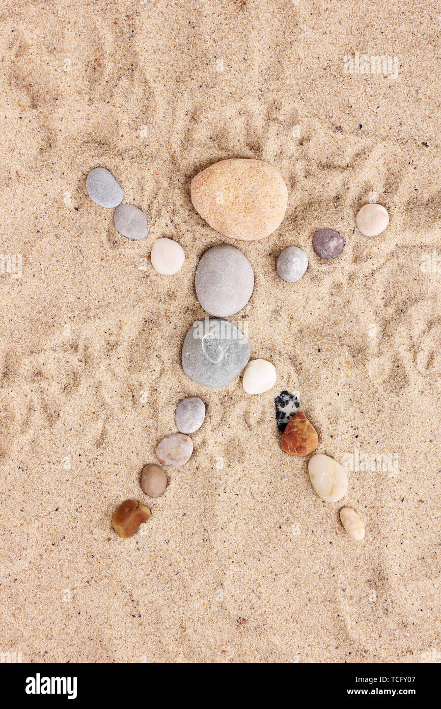 Man-stones on sand Stock Photo - Alamy