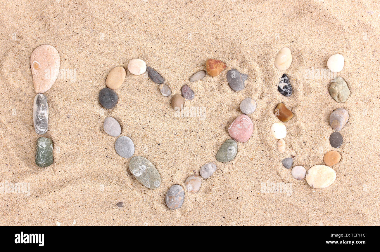 Love-stones on sand Stock Photo - Alamy