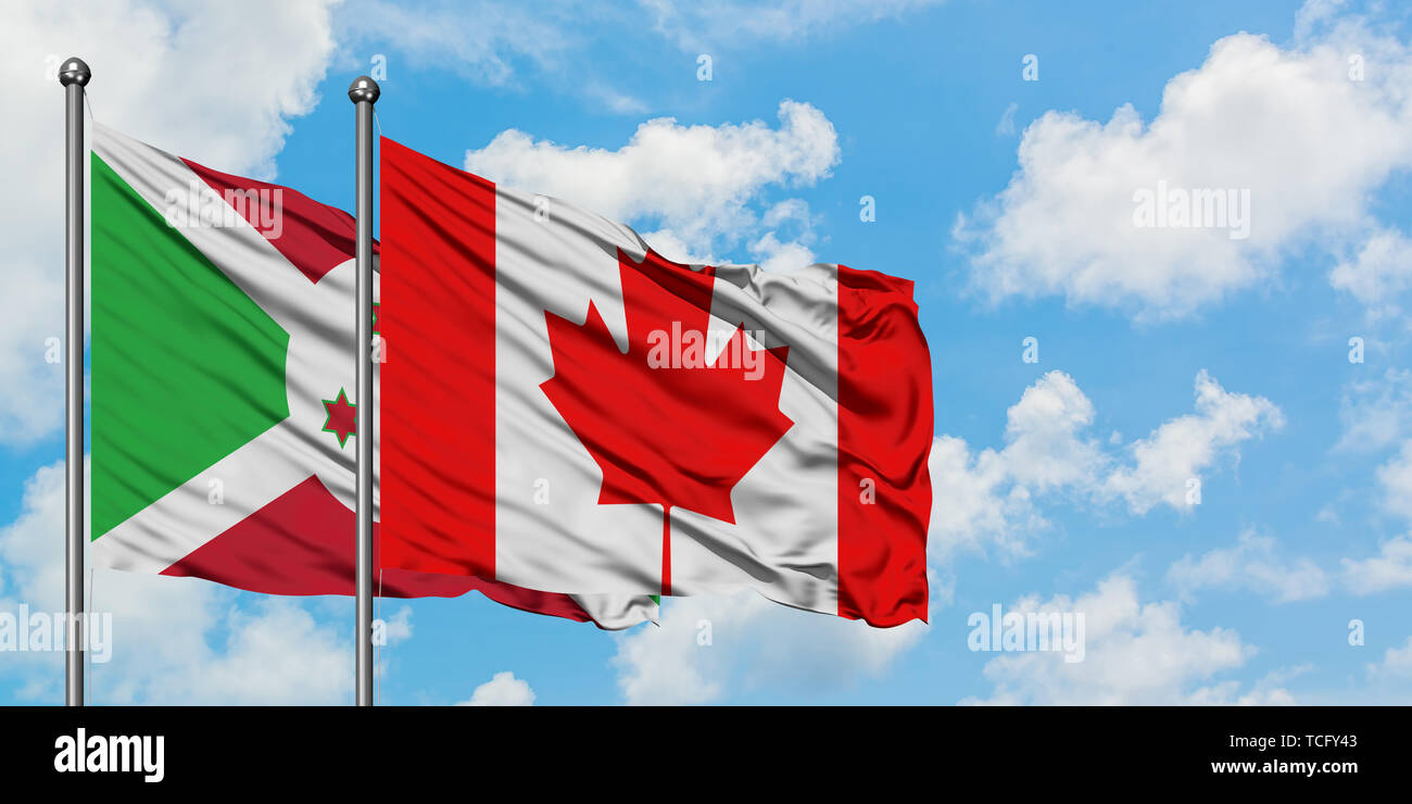 Burundi and Canada flag waving in the wind against white cloudy blue ...