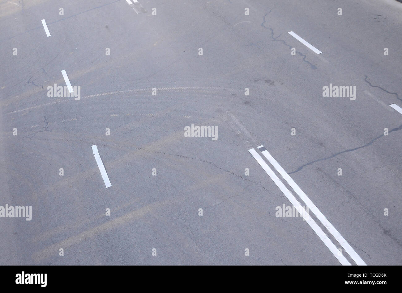 Damaged bad asphalt road with potholes. Patch repair of asphalt. Bad ...