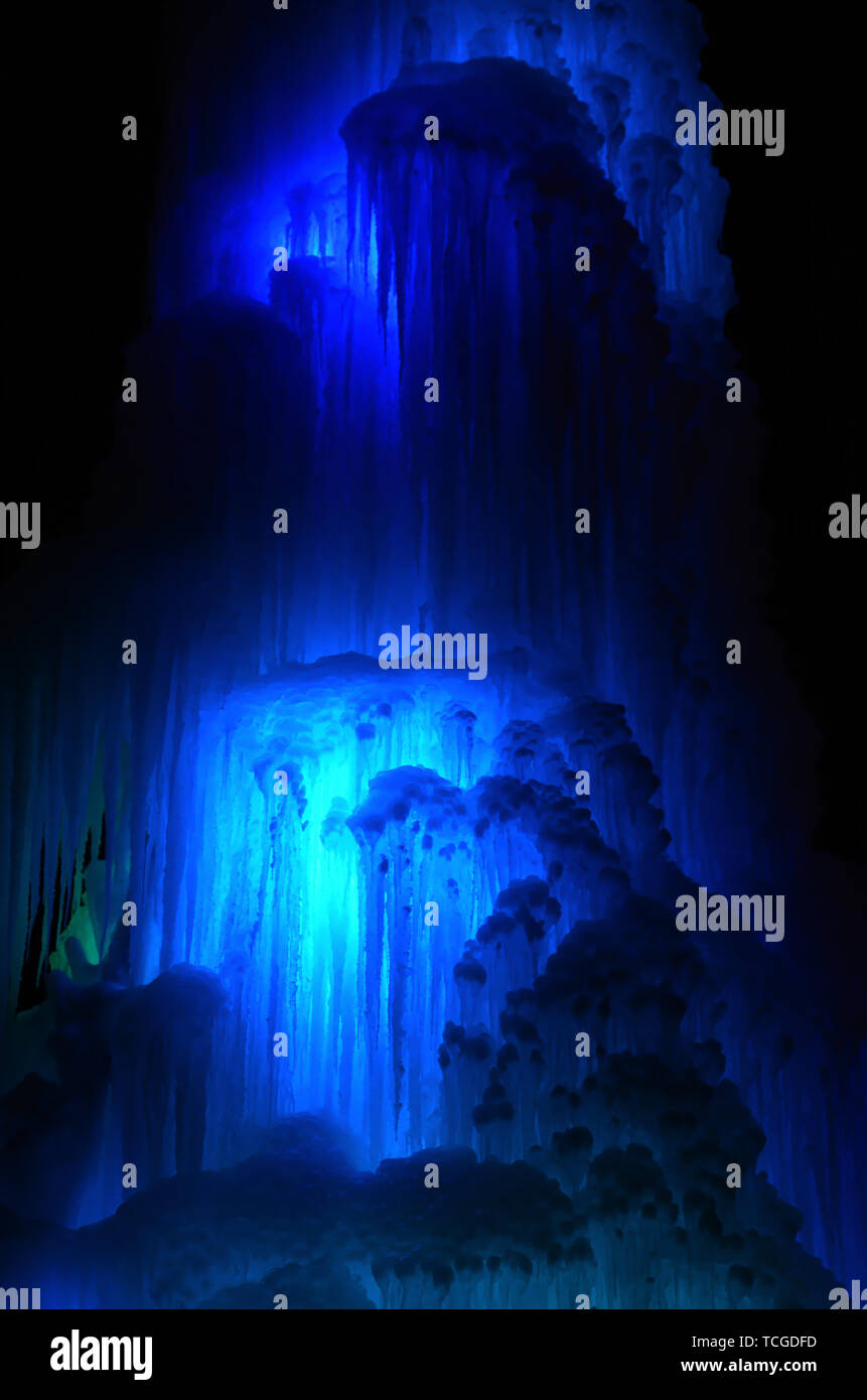 Huge ice icicles. Fragment of large blocks of ice frozen waterfall of ...