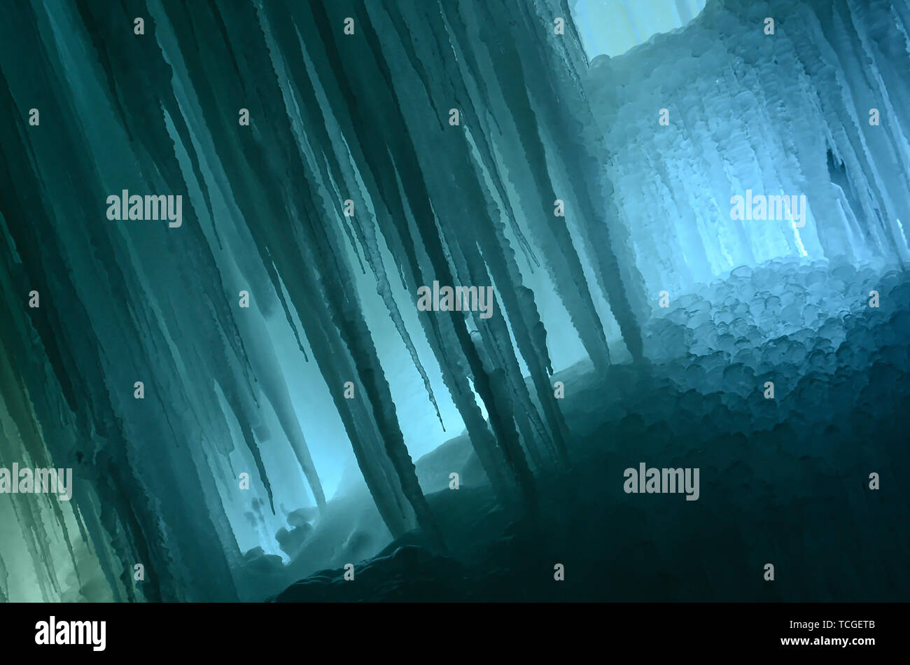 Huge ice icicles. Fragment of large blocks of ice frozen waterfall of ...