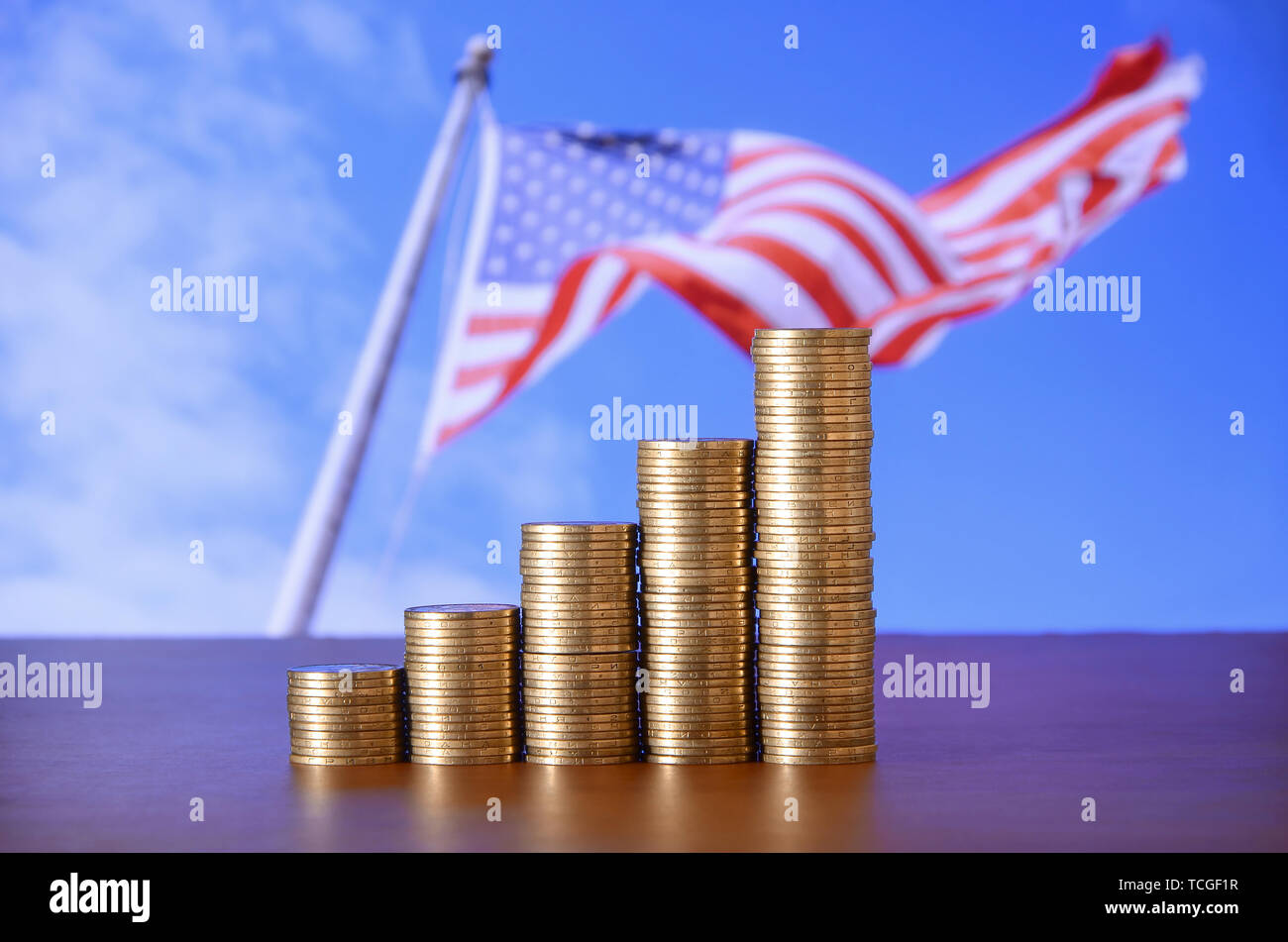 Golden coin stacks arranged as a graph. Increasing columns of coins ...