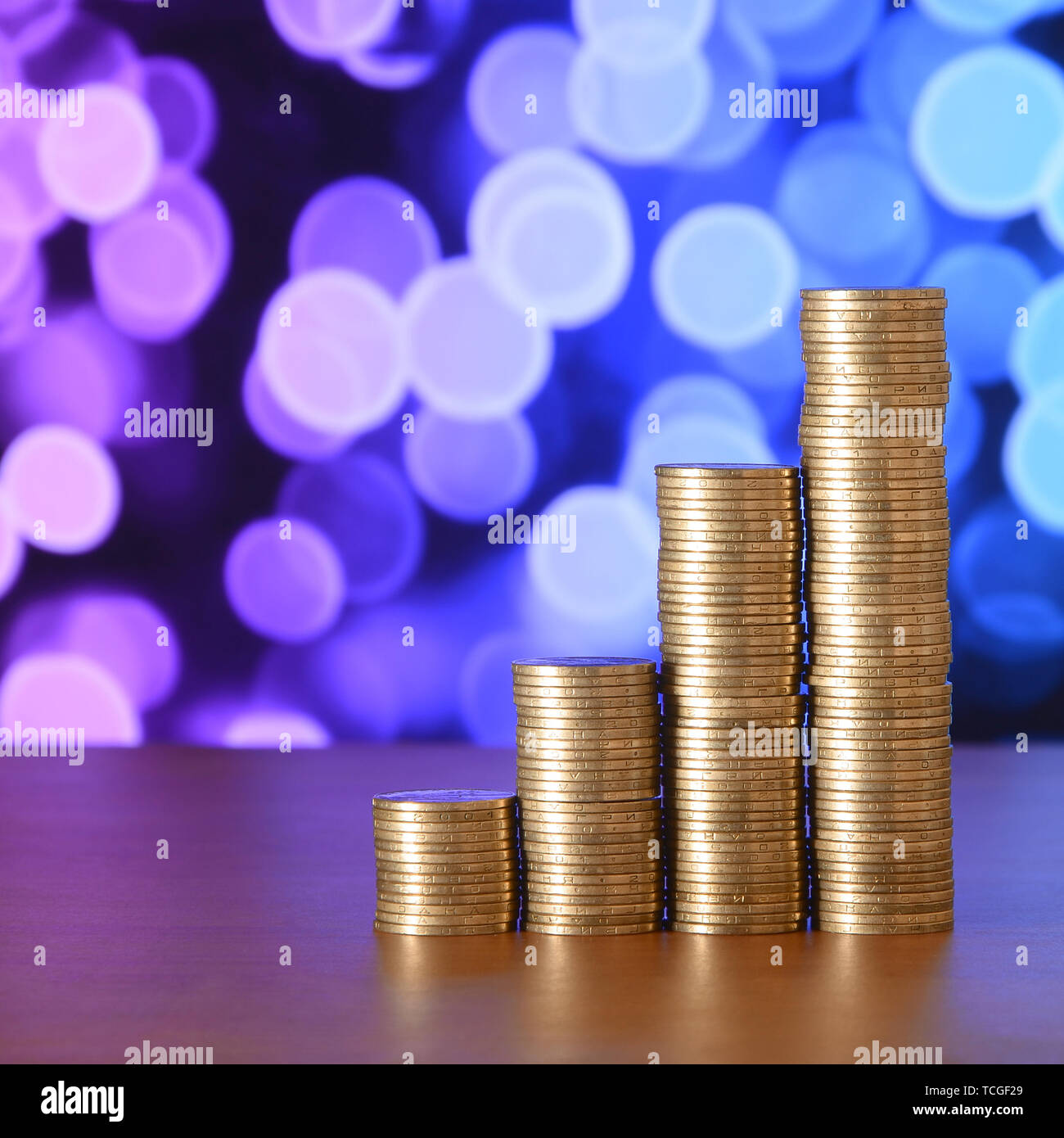 Golden coin stacks arranged as a graph. Increasing columns of coins ...
