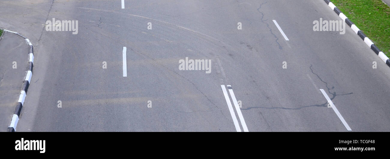 Damaged bad asphalt road with potholes. Patch repair of asphalt. Bad ...