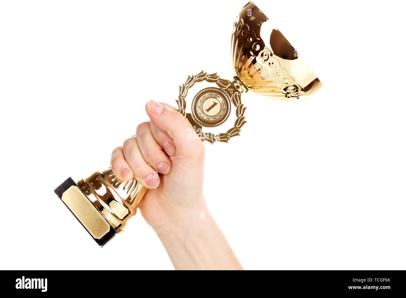 Trophy cup in hand isolated on white Stock Photo - Alamy