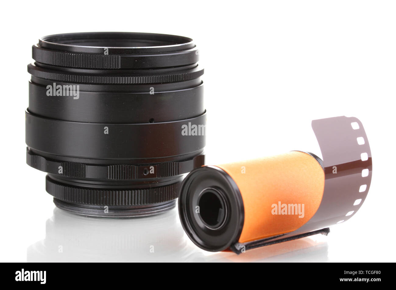 New photo film in cartridge and camera lens isolated on white Stock ...