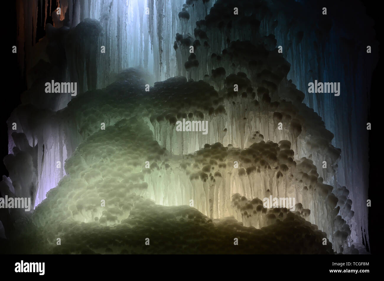 Huge ice icicles. Fragment of large blocks of ice frozen waterfall of ...