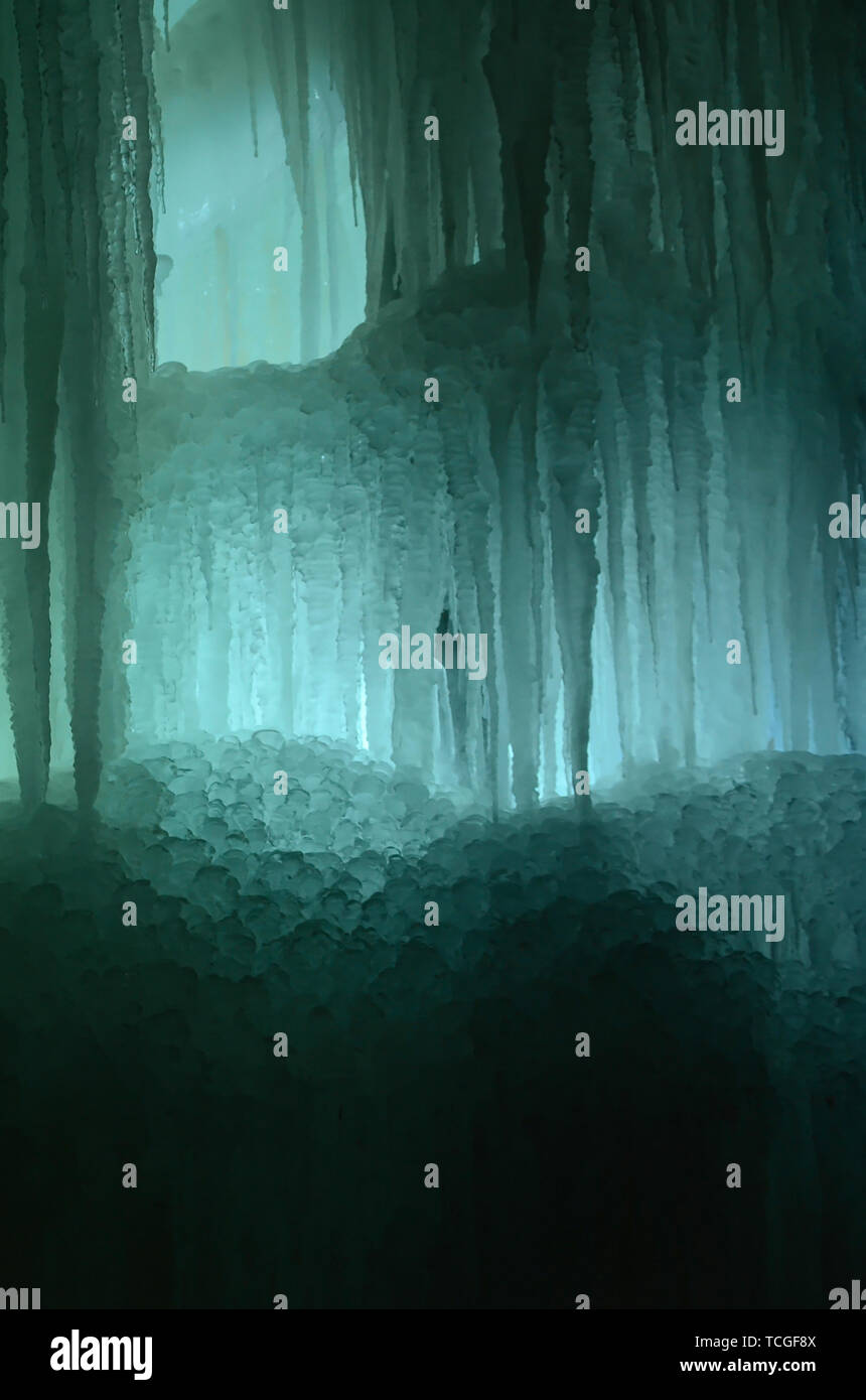 Huge ice icicles. Fragment of large blocks of ice frozen waterfall of ...