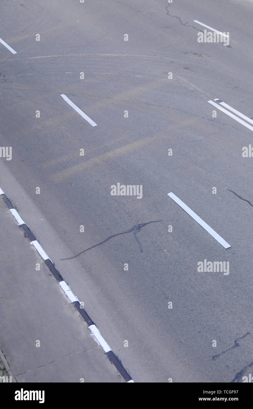 Damaged bad asphalt road with potholes. Patch repair of asphalt. Bad ...