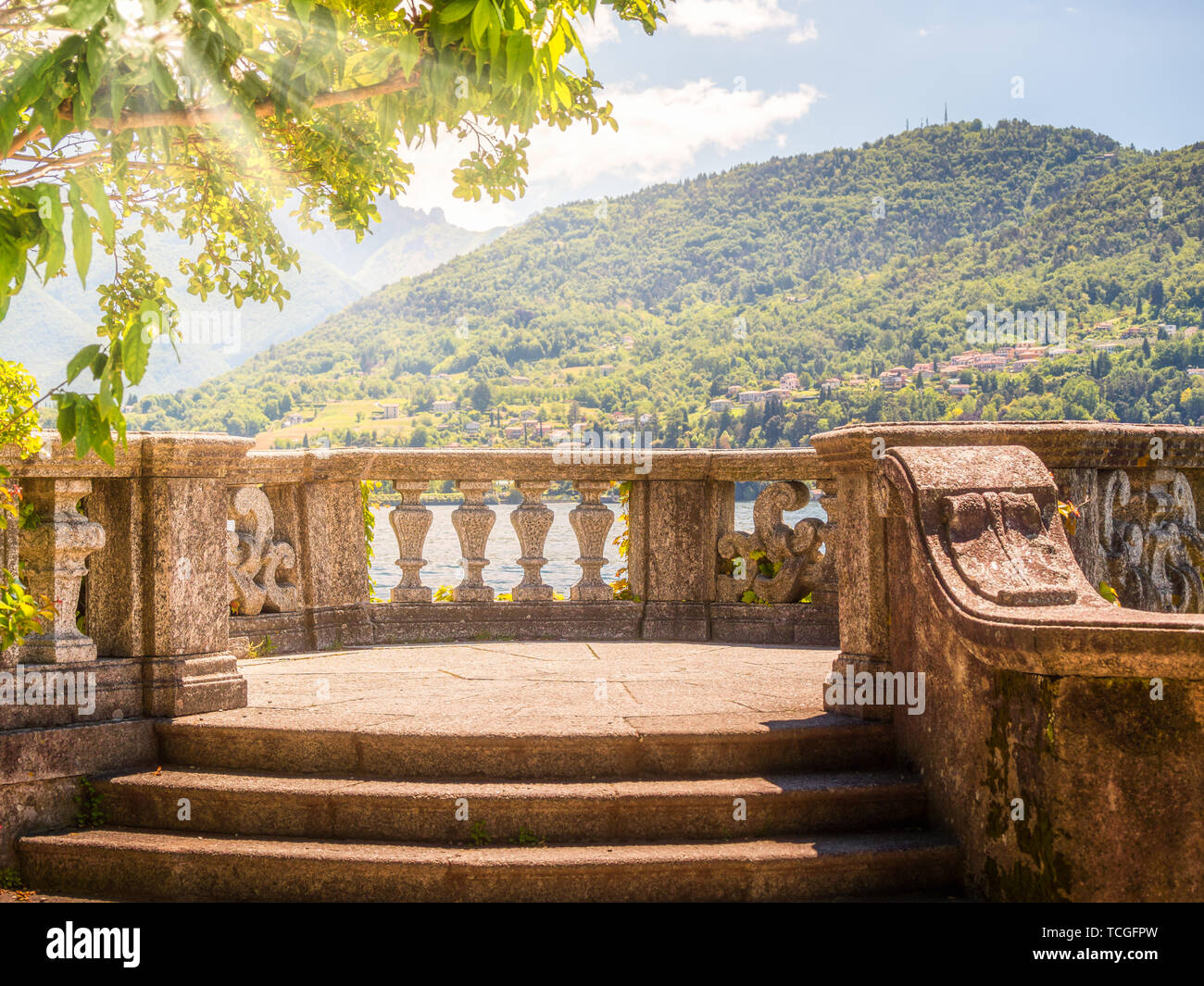 Image of Italian stone balustrade illuminated by sun rays and water in ...