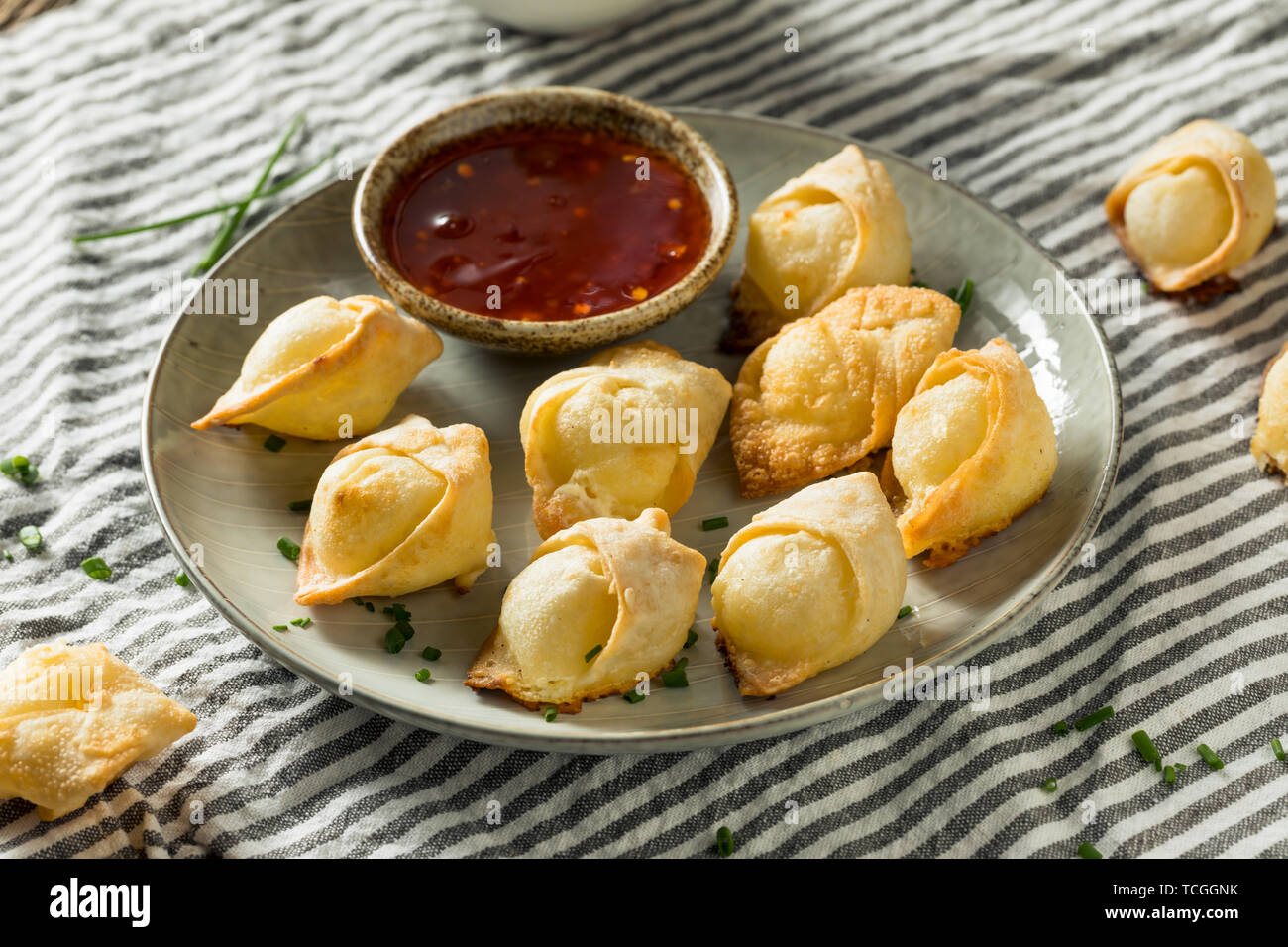 Chinese Cream Cheese Wontons with Sweet and Sour Sauce Stock Photo - Alamy