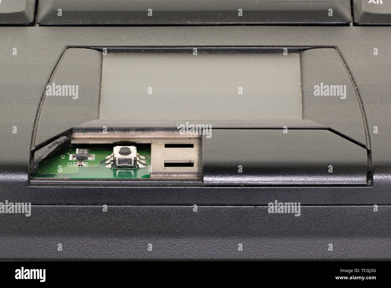 broken mouse pad on old laptop Stock Photo - Alamy