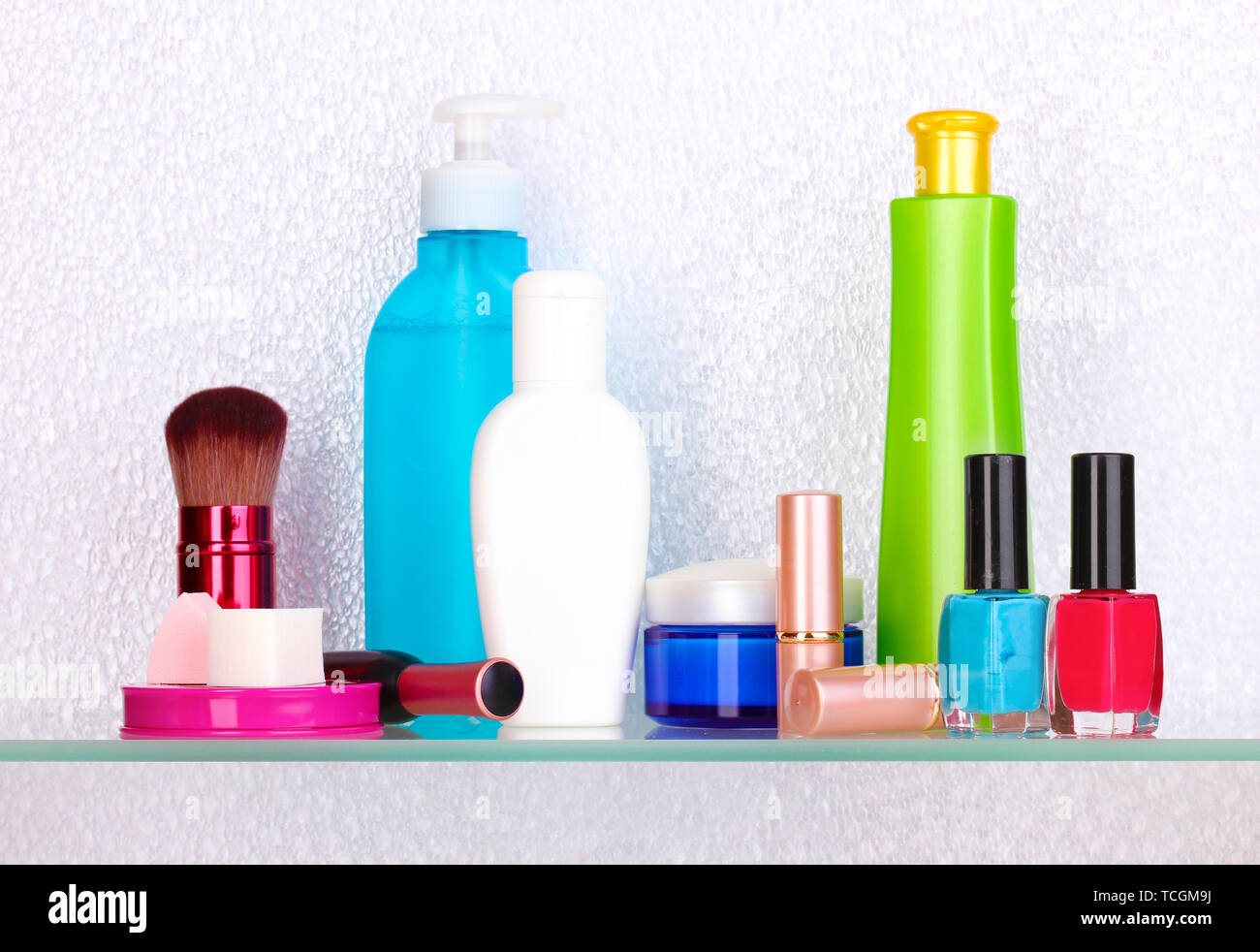 Shelf with cosmetics and toiletries in bathroom Stock Photo - Alamy