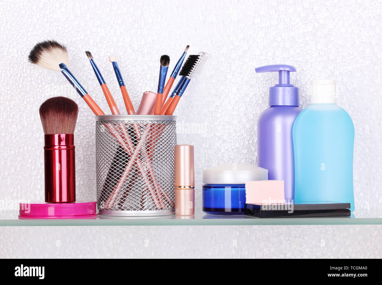 Shelf with cosmetics and toiletries in bathroom Stock Photo - Alamy