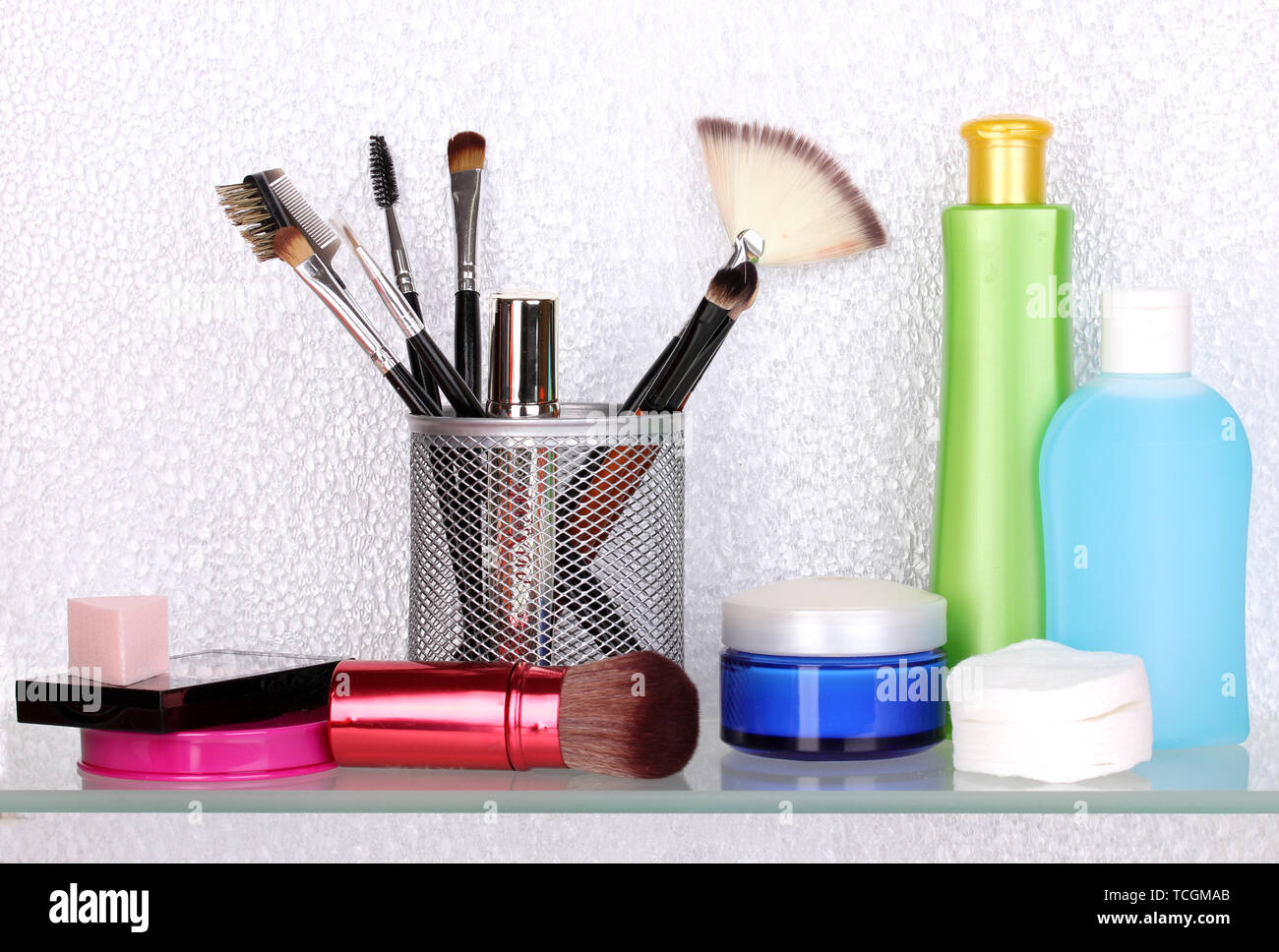 Shelf with cosmetics and toiletries in bathroom Stock Photo - Alamy