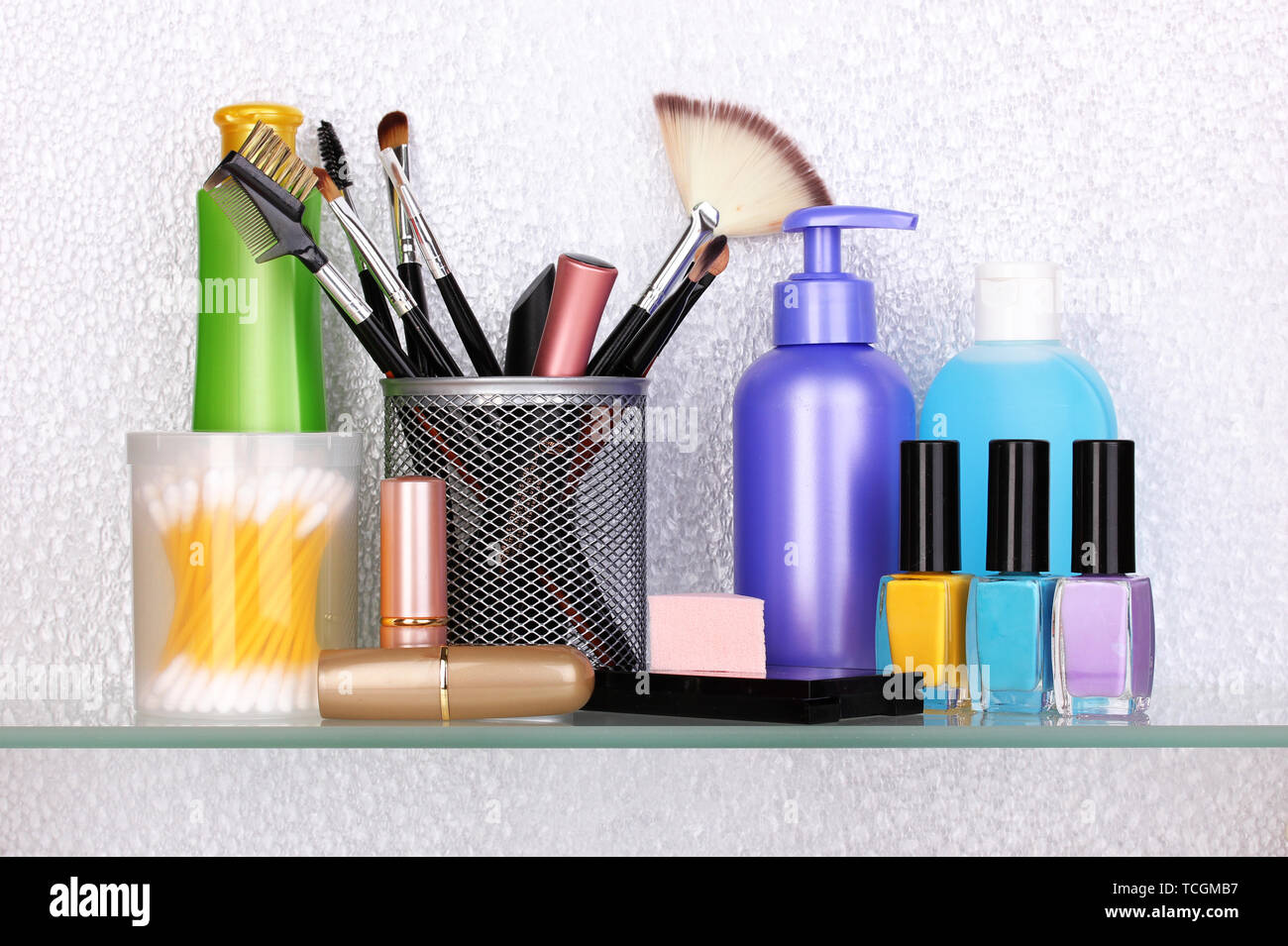 Shelf with cosmetics and toiletries in bathroom Stock Photo - Alamy