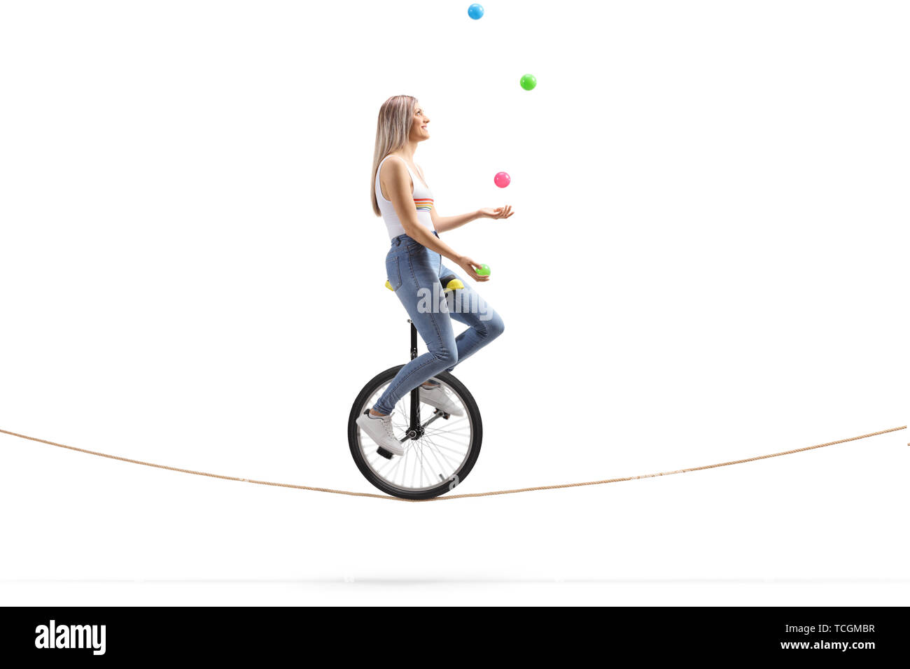 Girl riding unicycle hi-res stock photography and images - Alamy