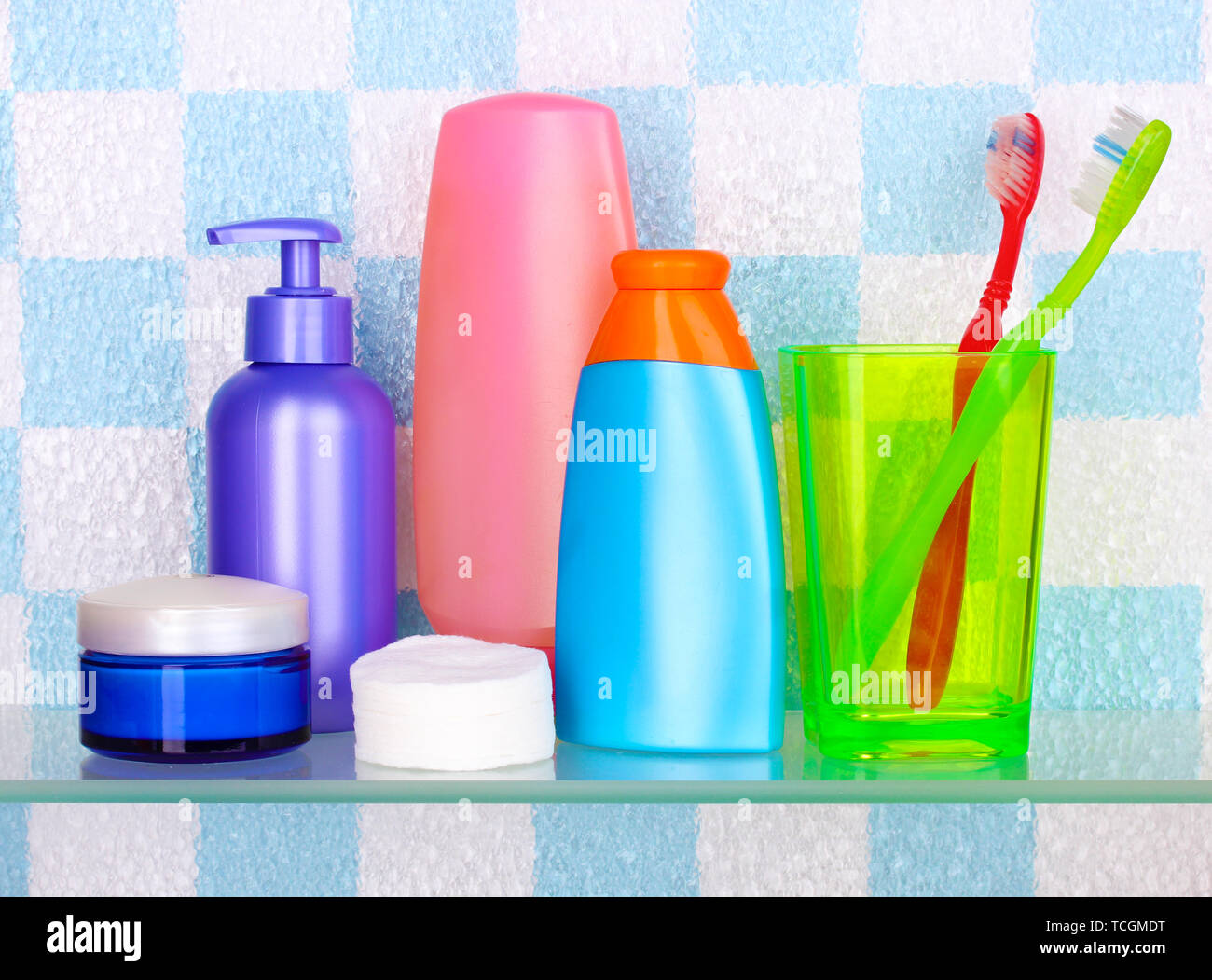 Shelf with cosmetics and toiletries in bathroom Stock Photo - Alamy