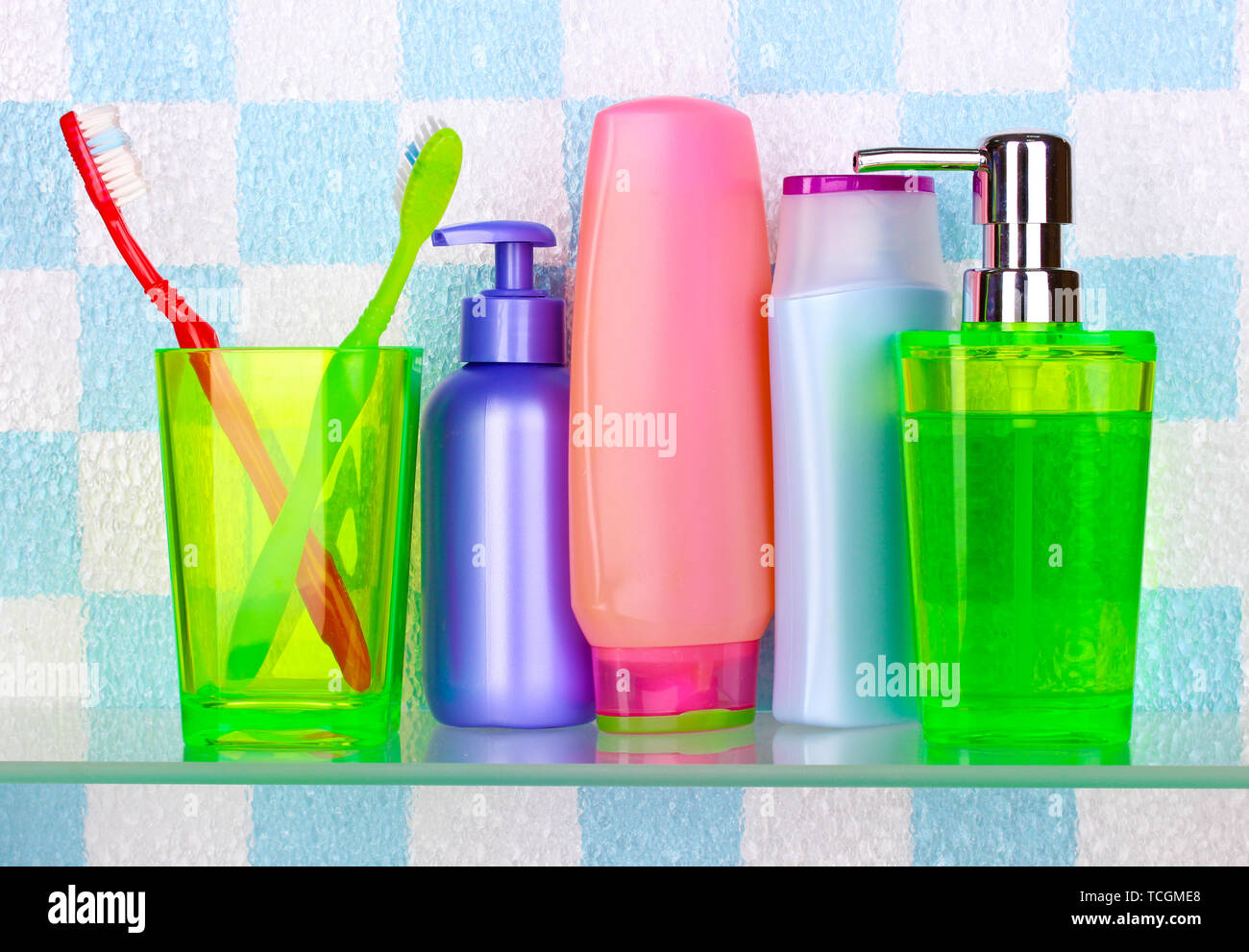 Shelf with cosmetics and toiletries in bathroom Stock Photo - Alamy