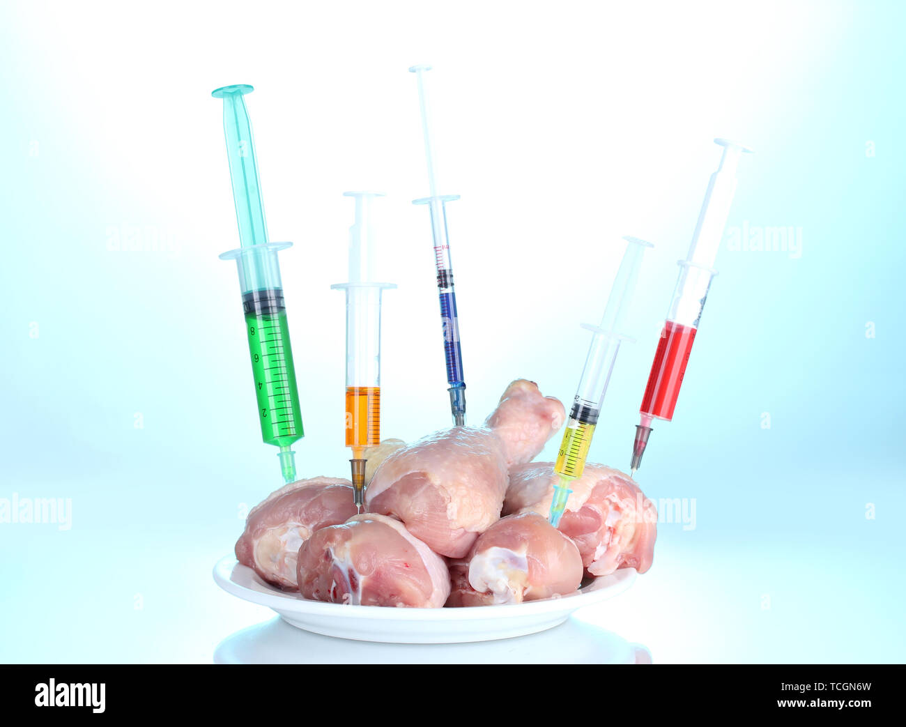 Genetically modified organism. GMO meat on blue background Stock Photo ...