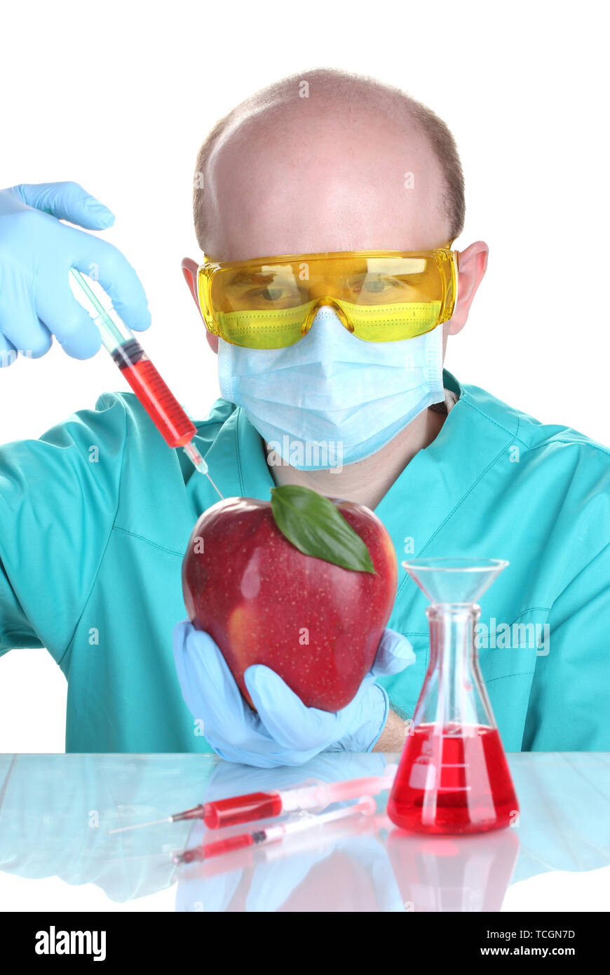Scientist injecting GMO into the apple Stock Photo - Alamy