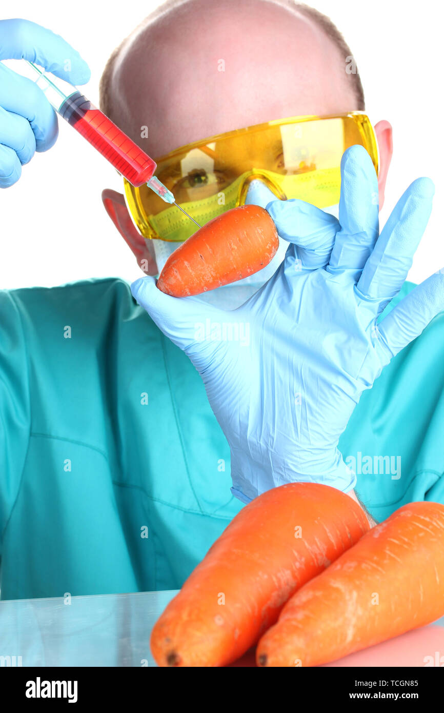 Scientist injecting GMO into the carrot Stock Photo - Alamy