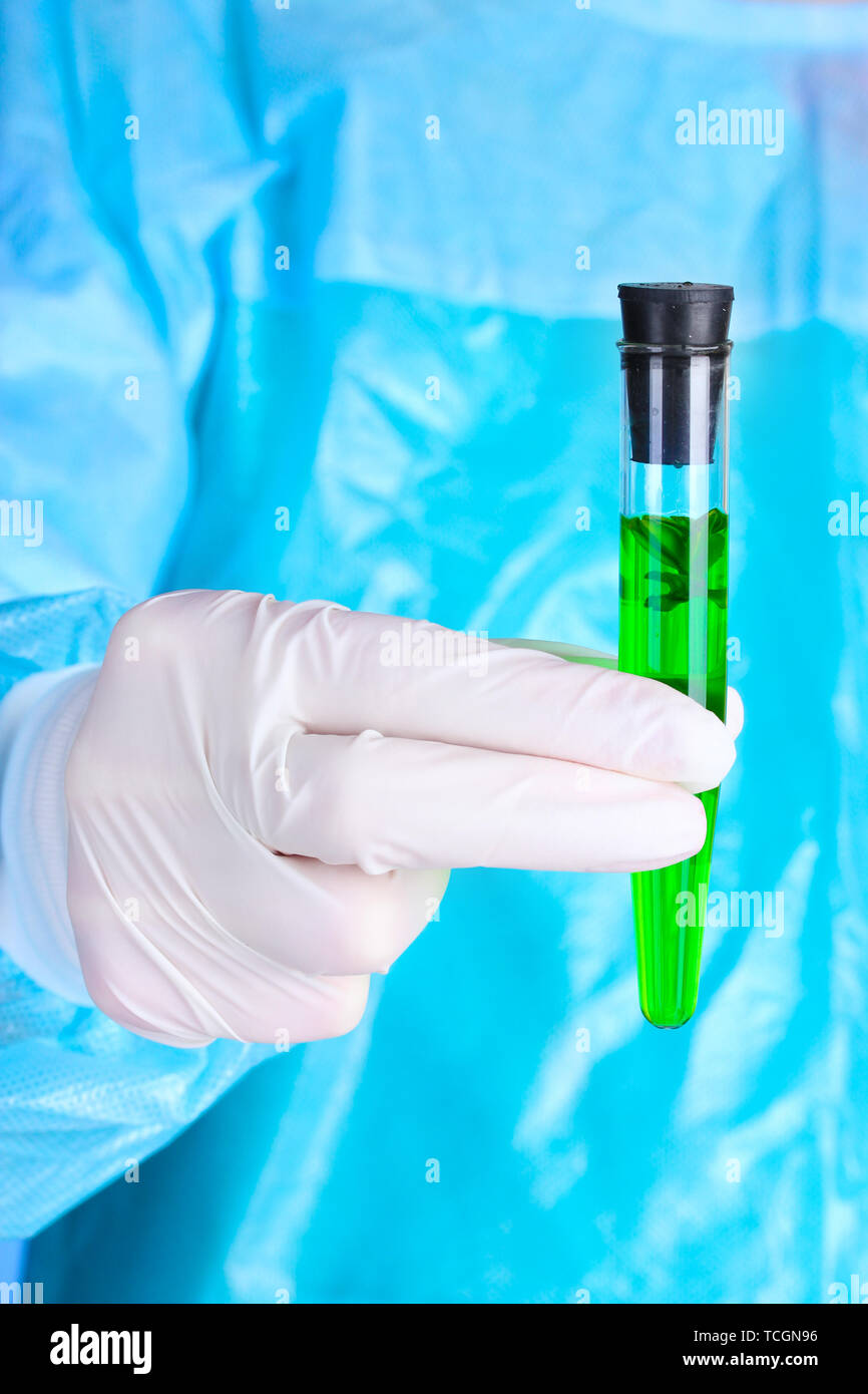 A scientist holds a test-tube with genetically modified plant Stock ...