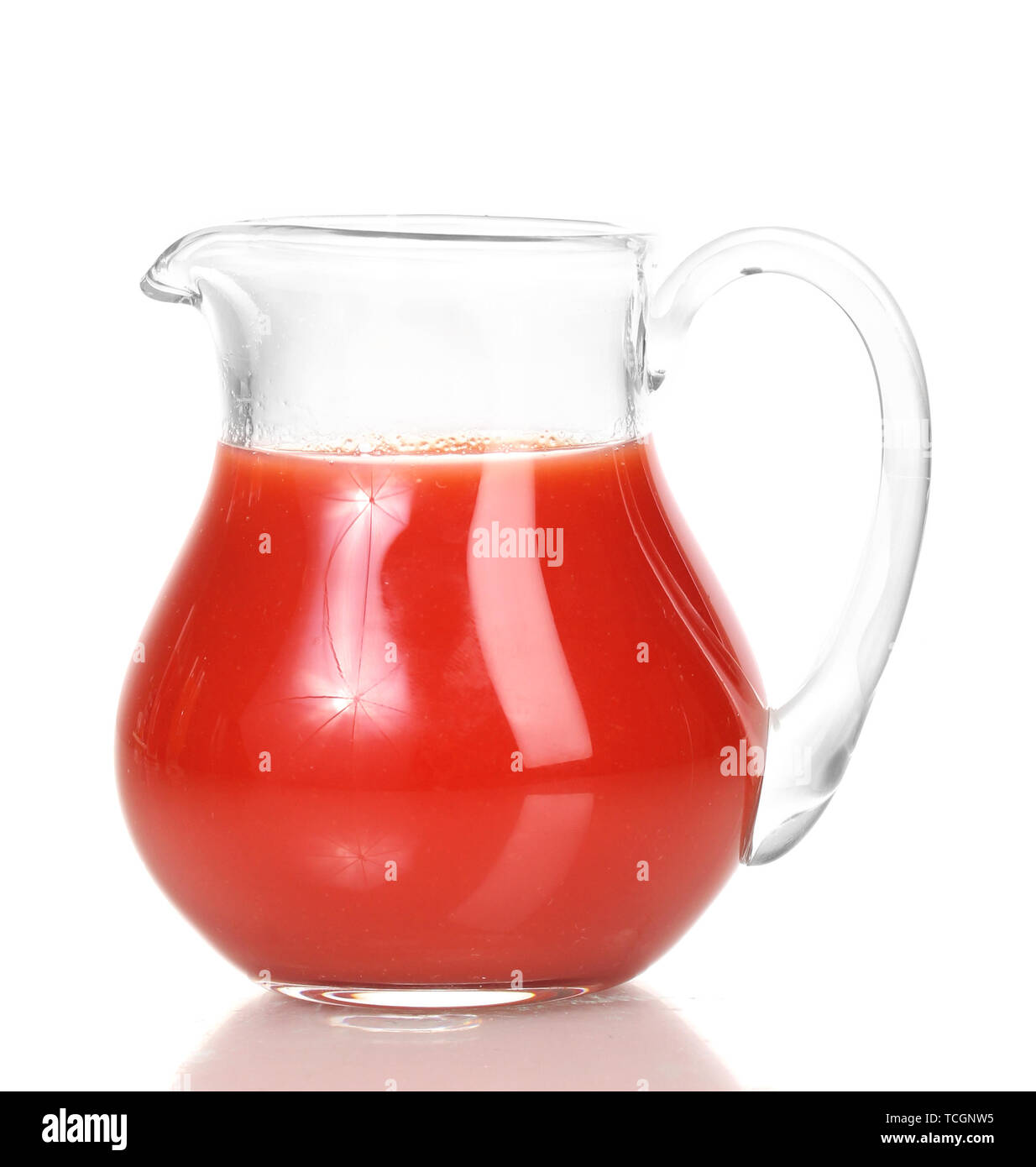 Tropical juice in glass pitcher isolated on white Stock Photo - Alamy