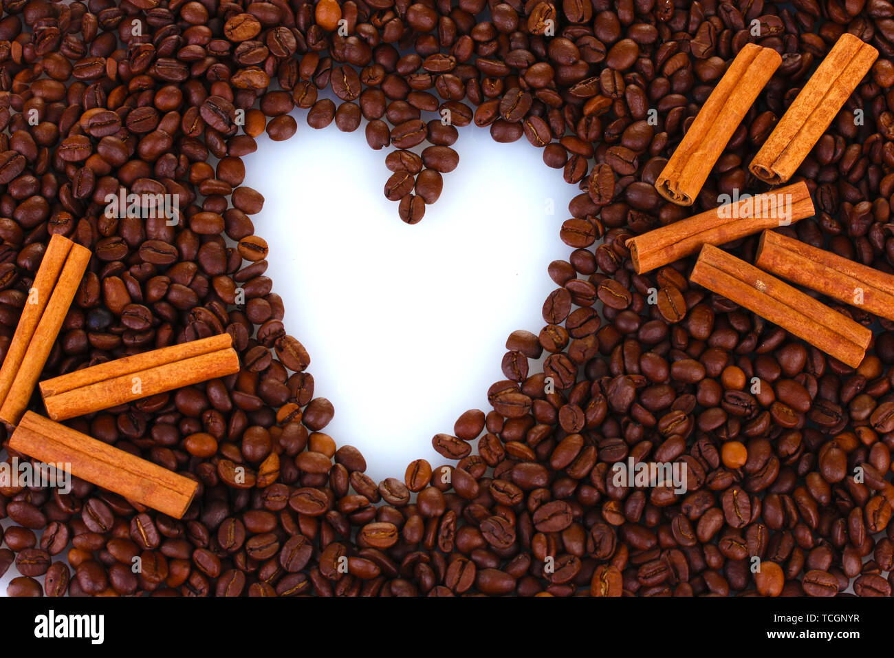Pattern of heart on coffee beans background. Frame Stock Photo - Alamy
