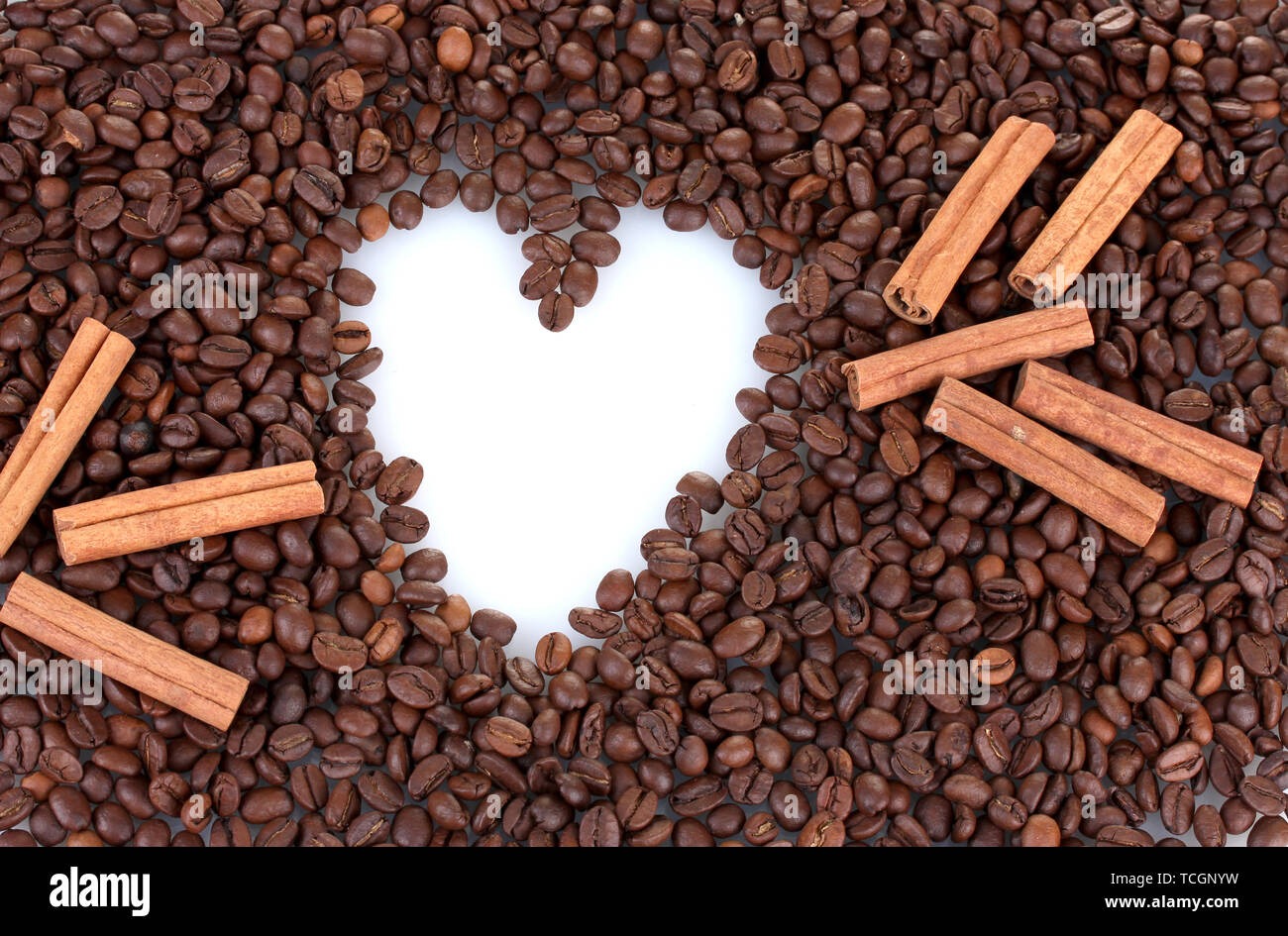 Pattern of heart on coffee beans background. Frame Stock Photo - Alamy