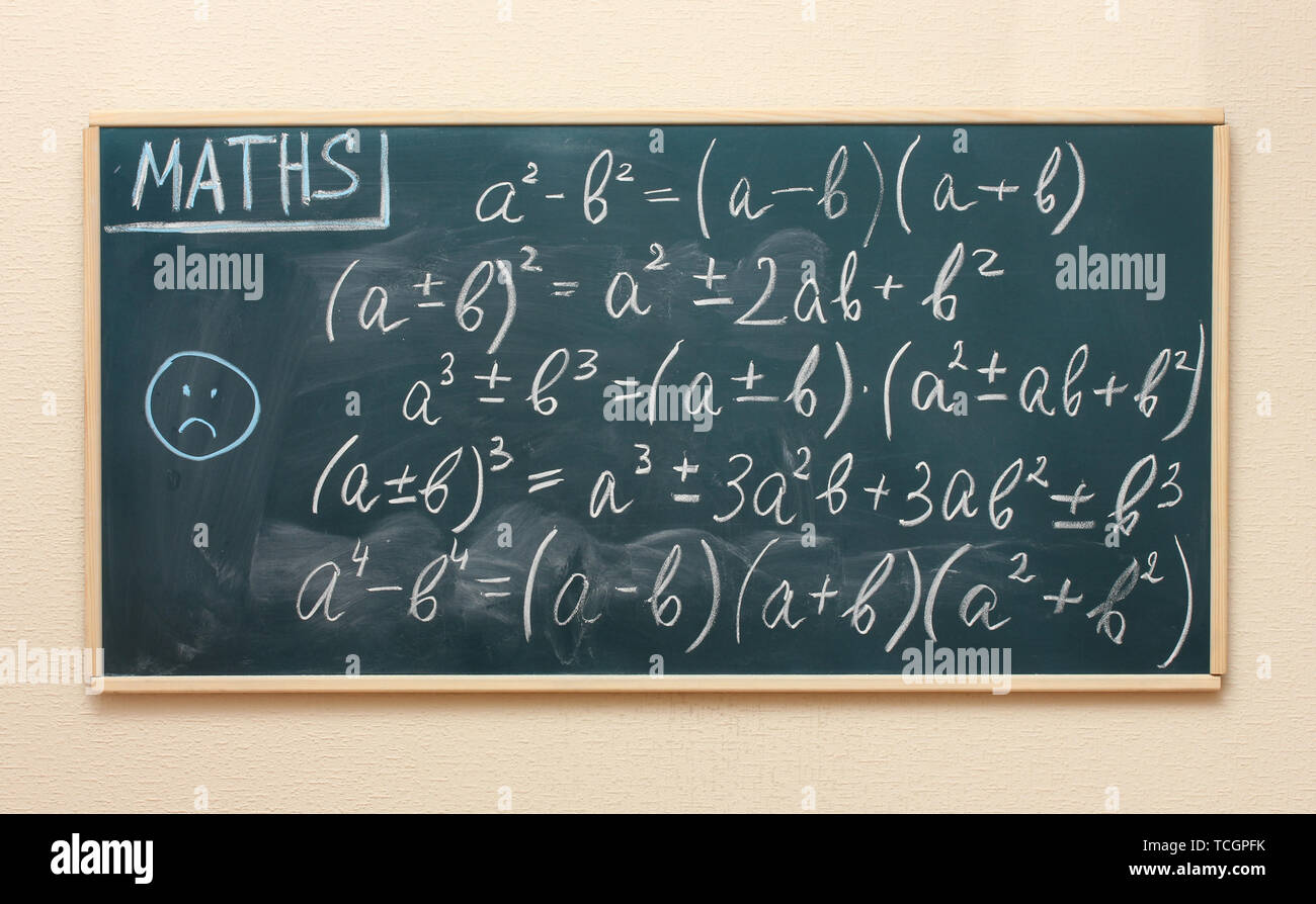 Math formulas written on the desk Stock Photo - Alamy