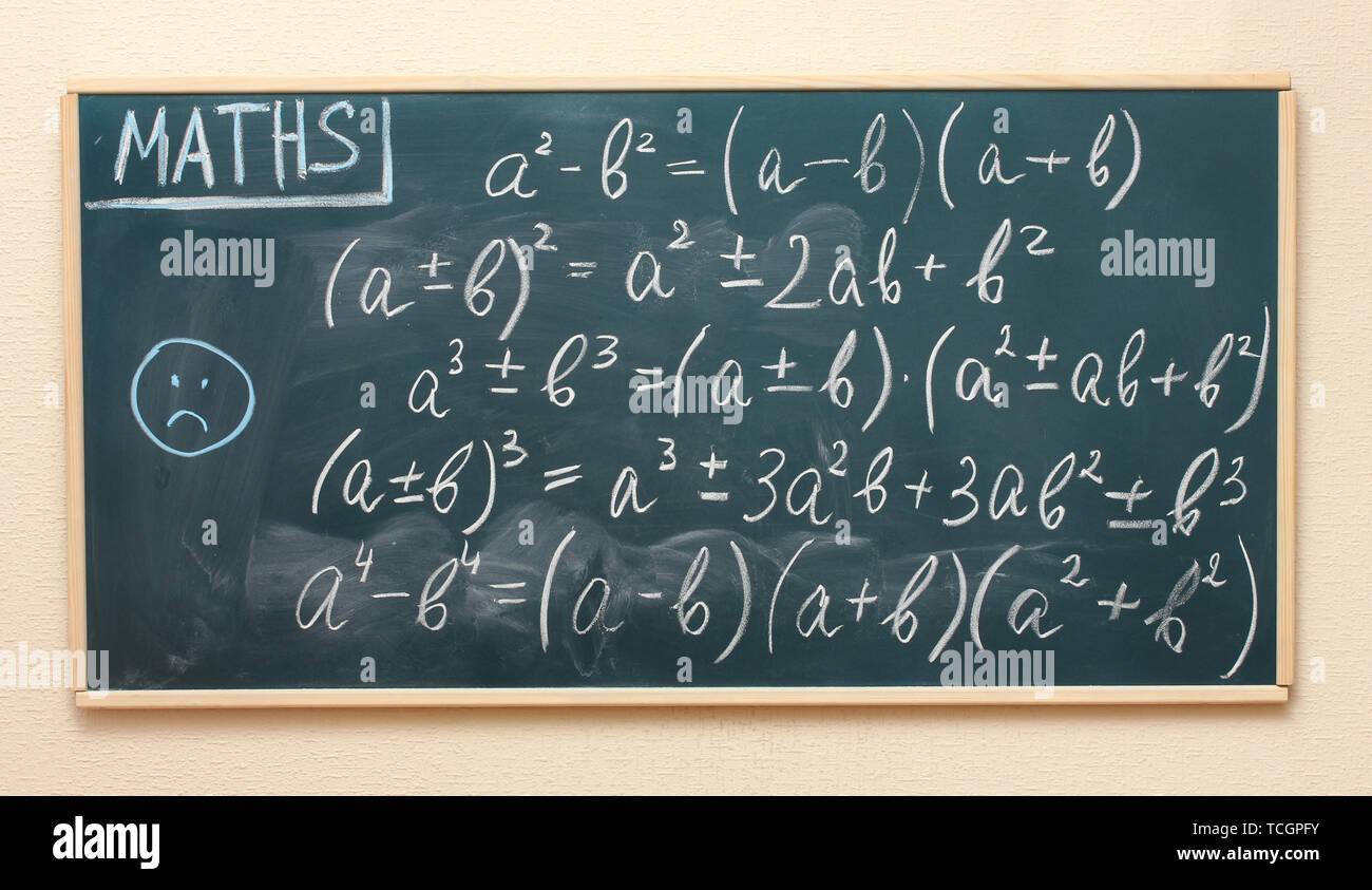 Math formulas written on the desk Stock Photo - Alamy