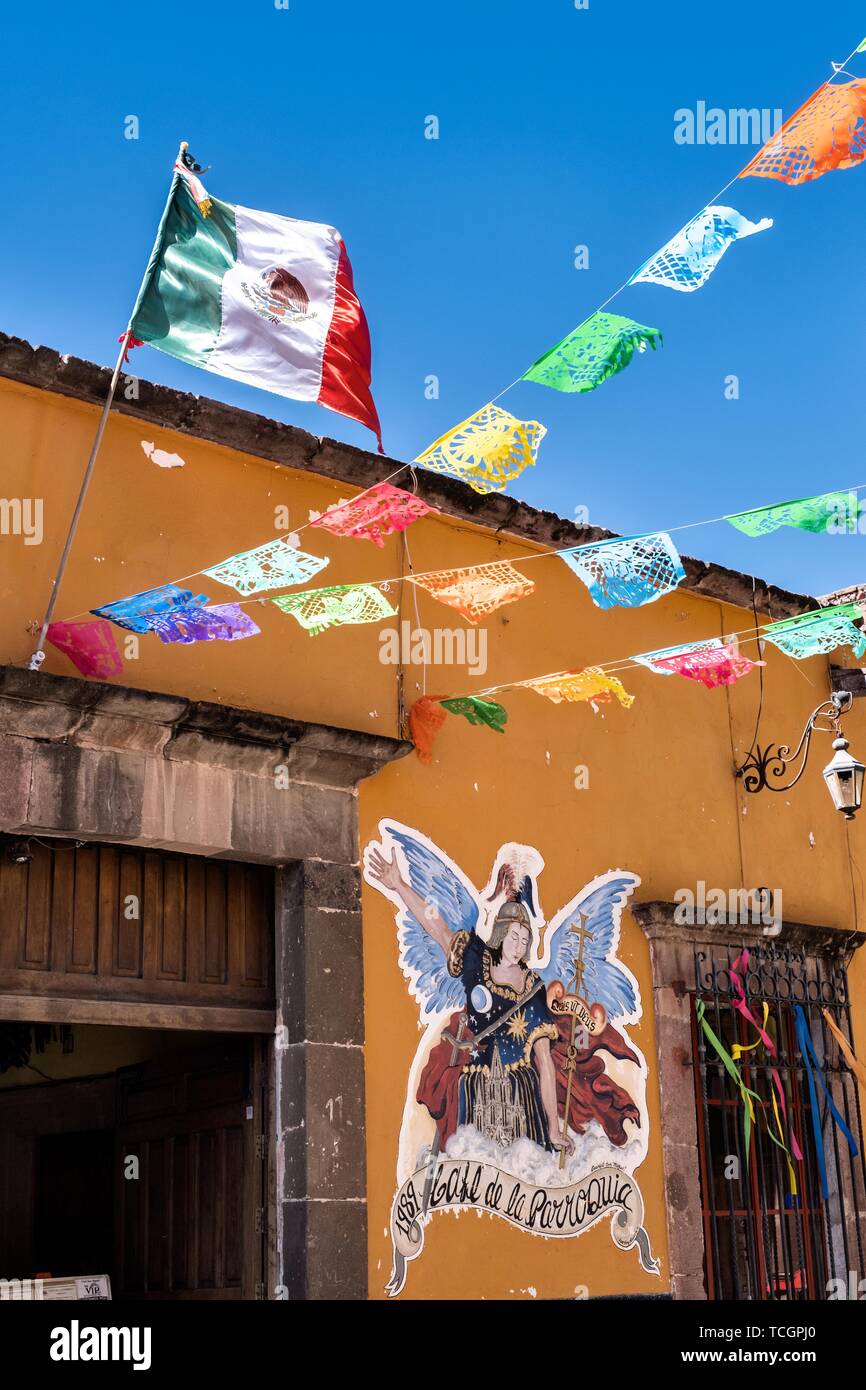 Paper fiesta banners against a clear blue sky decorate Jesus Street in ...