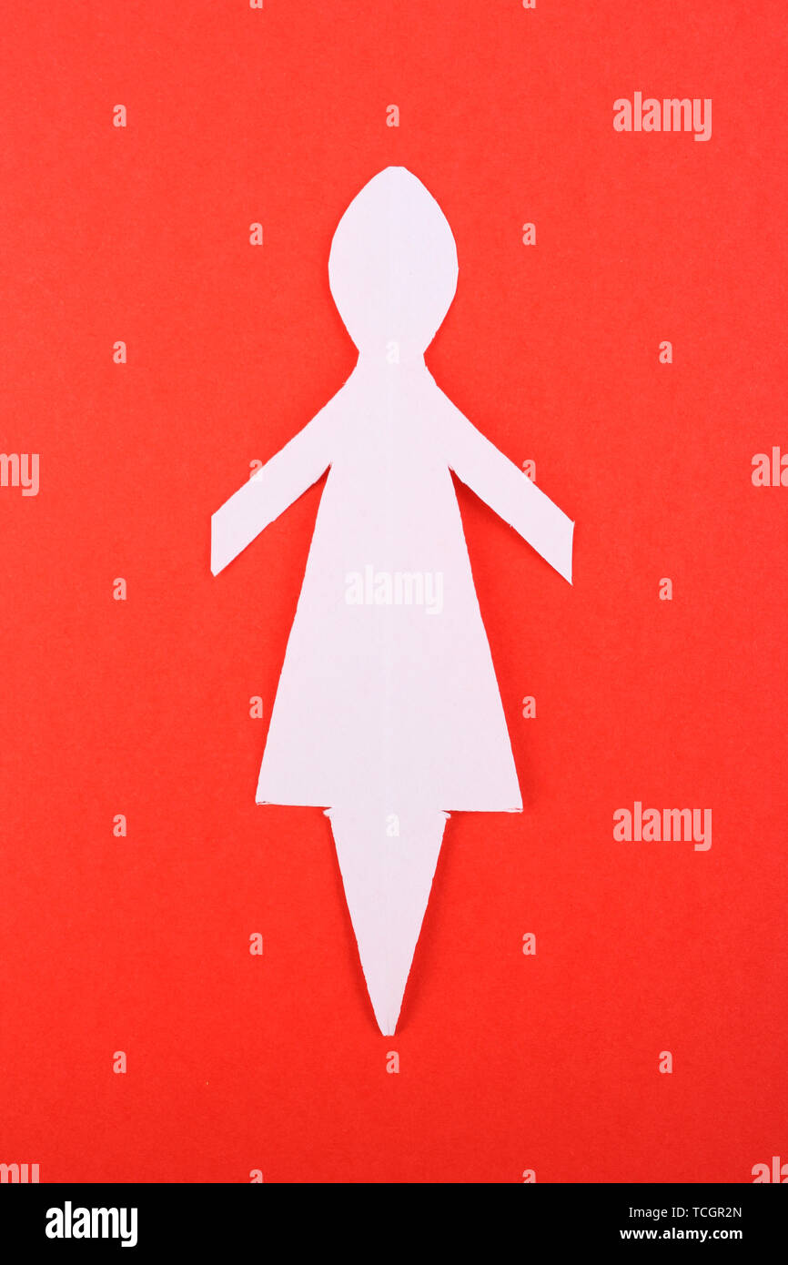 Paper woman on red background Stock Photo - Alamy