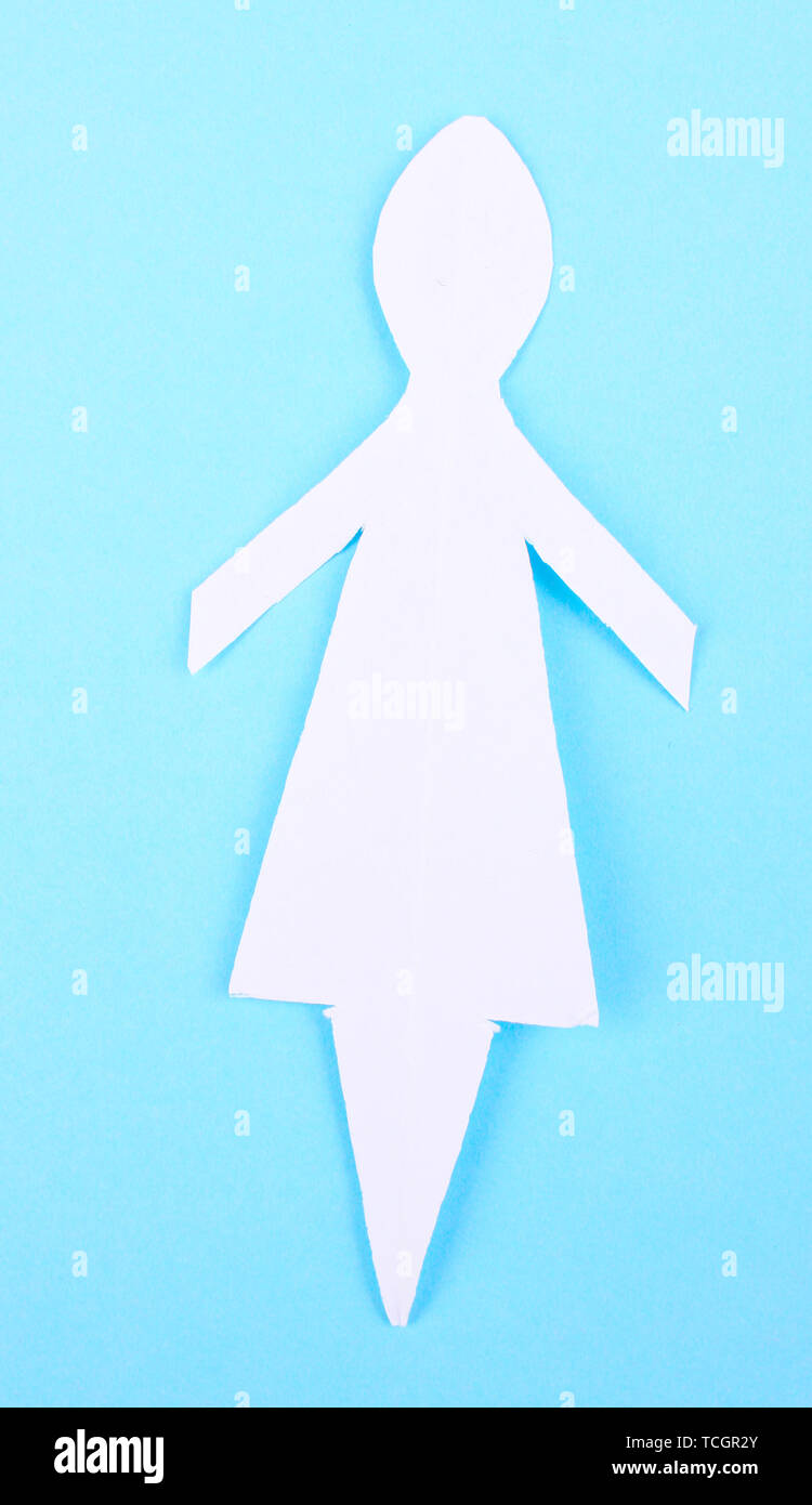 Paper woman on blue background Stock Photo - Alamy