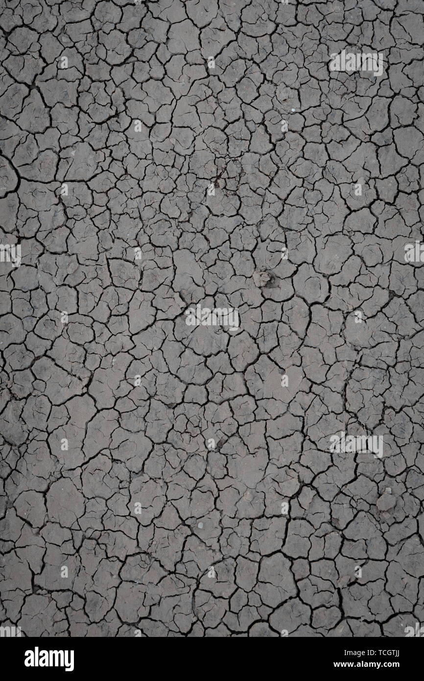 Dry Soil Texture along Badlands ground vertical background Stock Photo ...