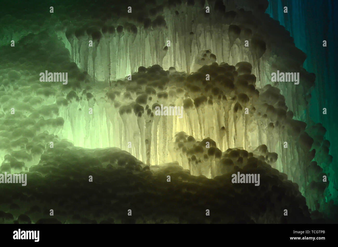 Huge ice icicles. Fragment of large blocks of ice frozen waterfall of ...