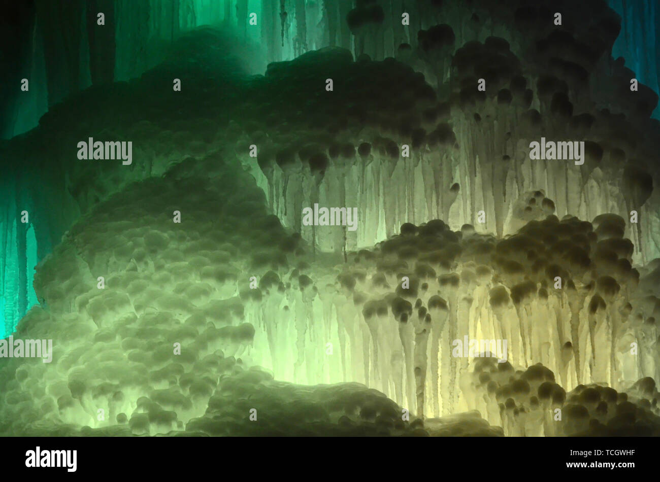 Huge ice icicles. Fragment of large blocks of ice frozen waterfall of ...